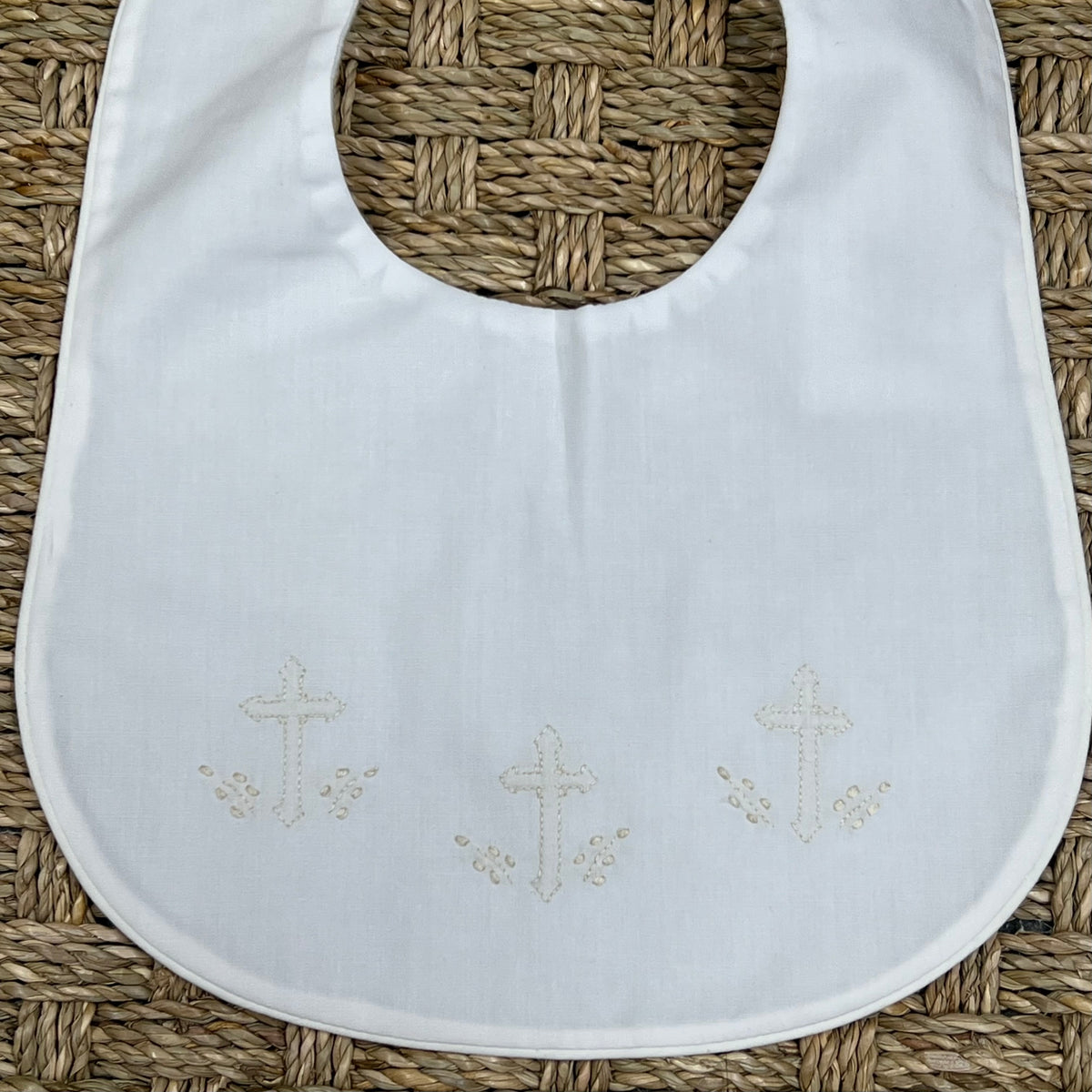 Auraluz Bib with Row of Crosses Embroidery in Ecru | shopnurseryrhymes